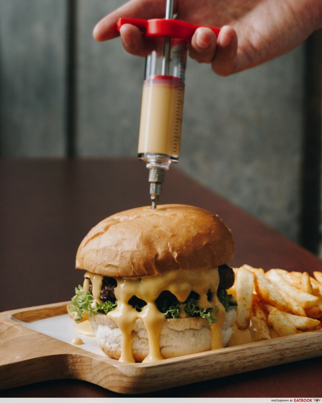 This Cafe In Jurong Lets You Inject Nacho Cheese Into Their Juicy ...