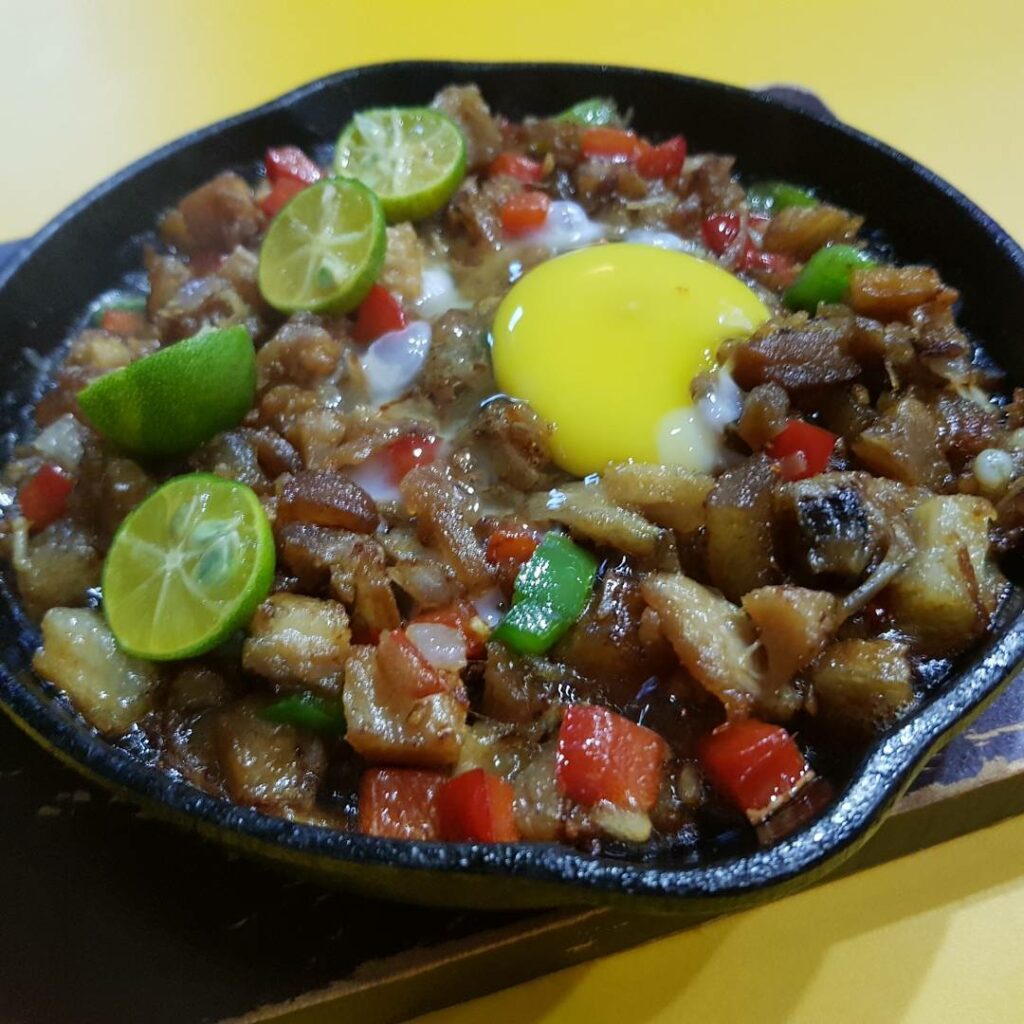 8 Filipino Food Places Serving Crispy Lechon, Sisig, Adobo, And Halo ...